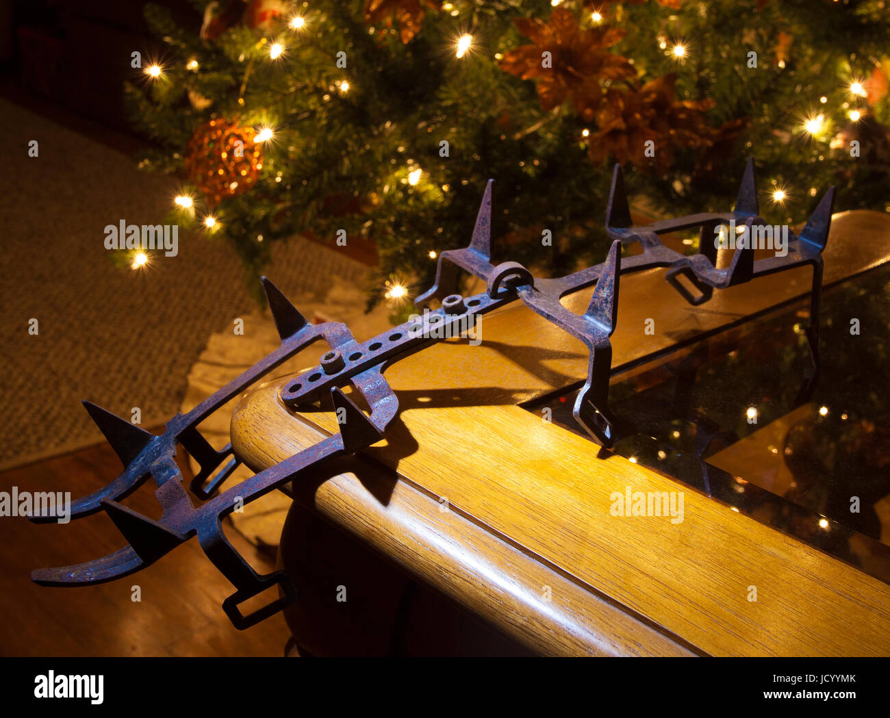 Crampon covered with rust with a Christmas tree behind Stock Photo - Alamy