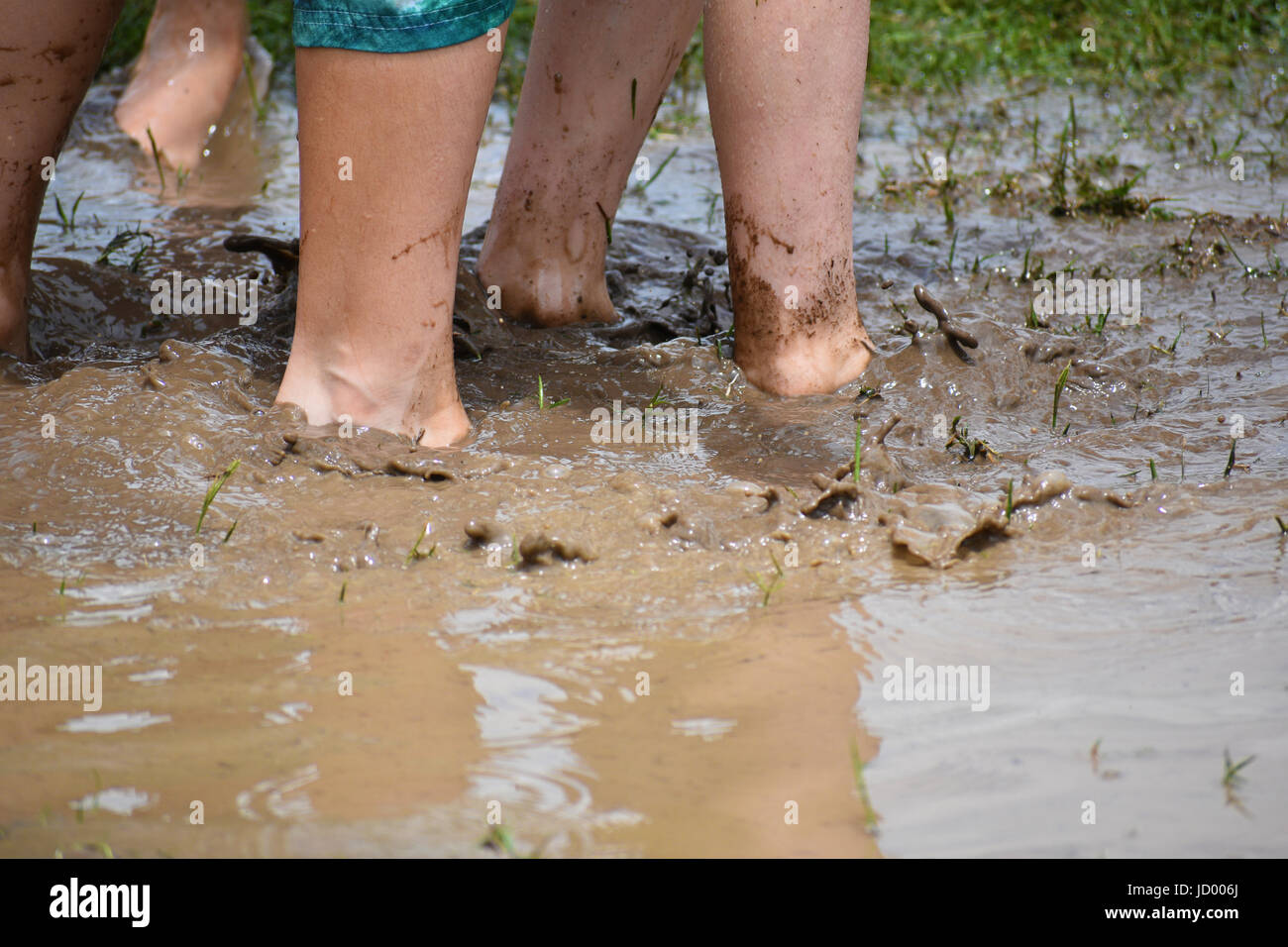Feet in Muddy Water Stock Photo - Alamy