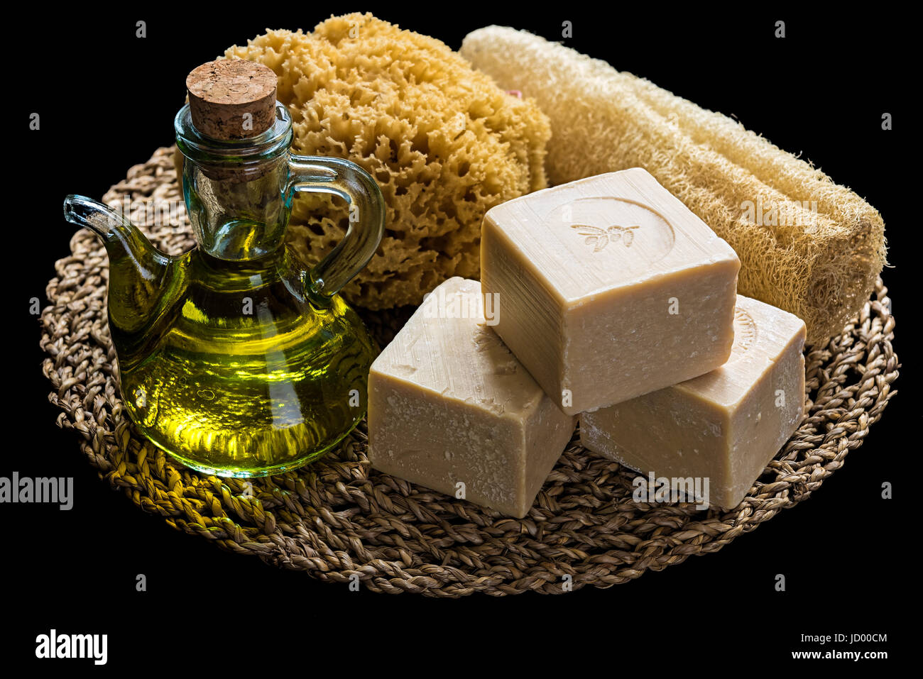Handmade olive oil soaps together with two sea sponges and an oil ...