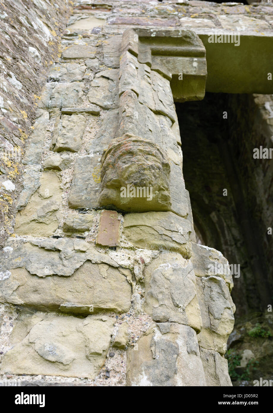 Worn and weathered Corbel stone and medieval stonework with stone ...
