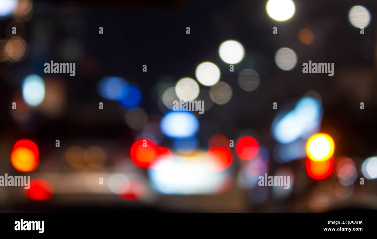 Defocus car tail lights in the night traffic. The shot was taken by ...