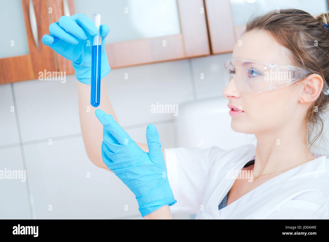 Bio Technology Female Worker. Woman Testing Bio Materials in the ...