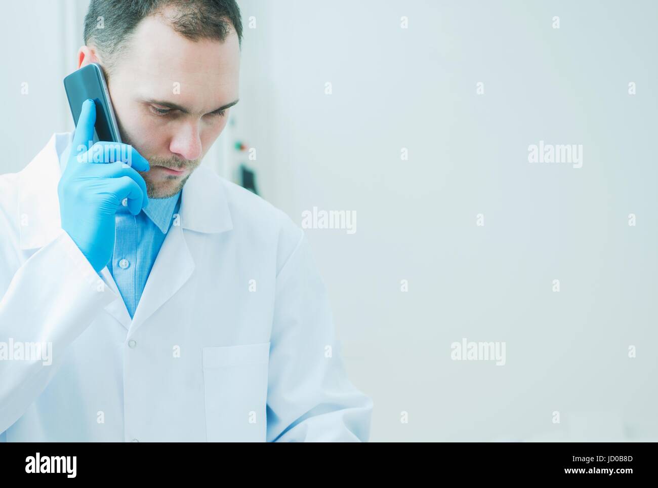 Caucasian Hospital Doctor Making Call Using Modern Smartphone Stock ...