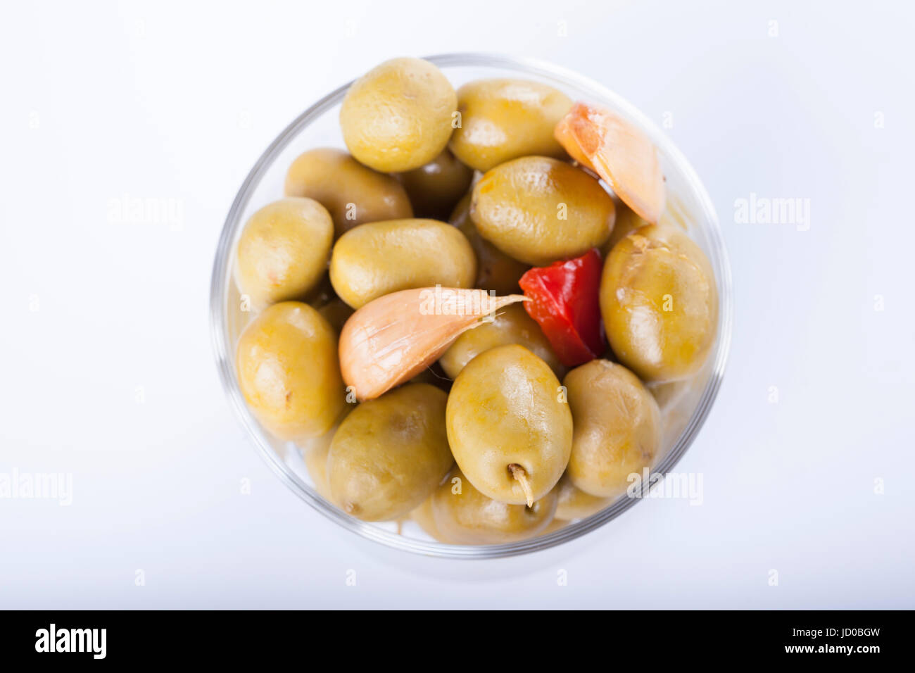 a handful of homemade olives on a glass, typical spanish tapa, isolated ...