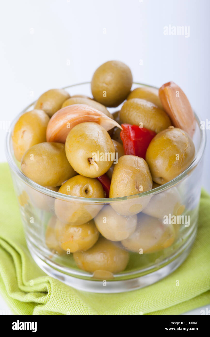 a handful of homemade olives on a glass, typical spanish tapa, isolated ...