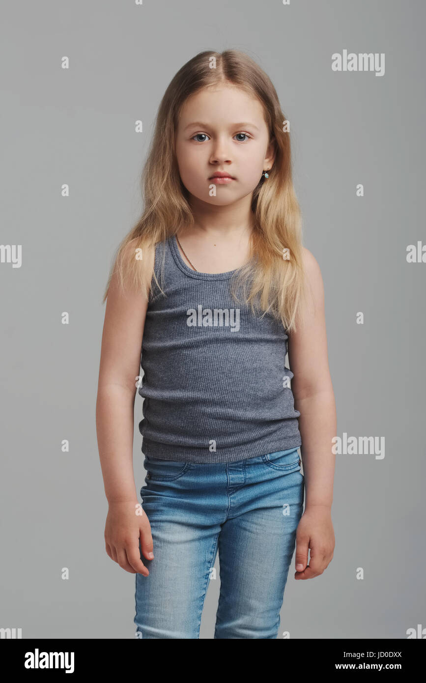little girl studio portrait on grey background Stock Photo - Alamy