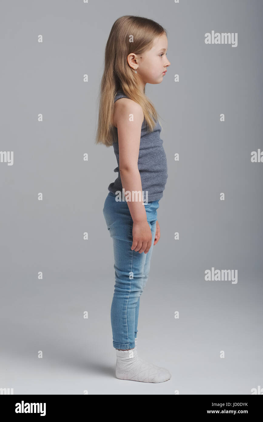 little girl studio portrait on grey background Stock Photo - Alamy