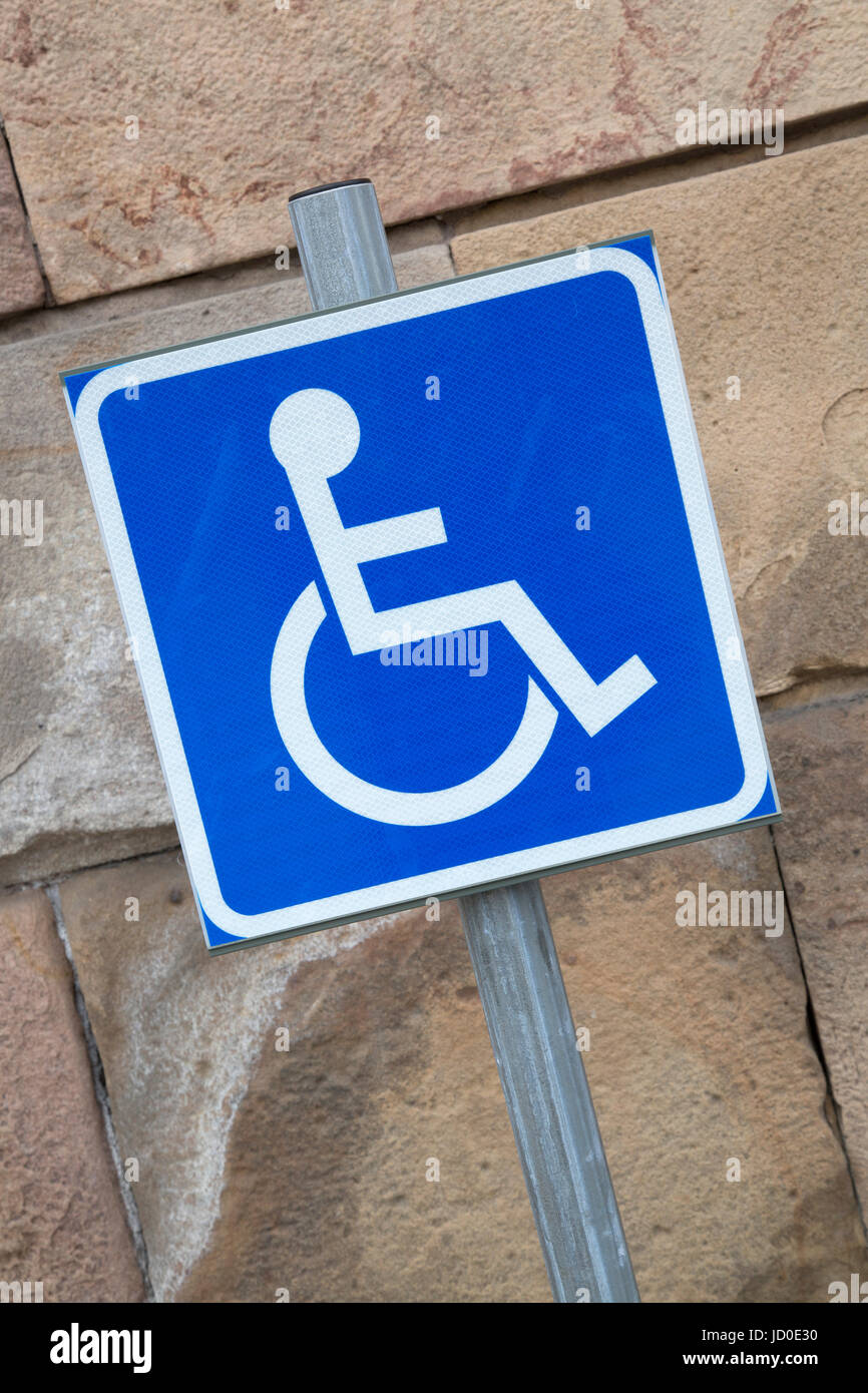 Disabled Parking Sign against Brick Wall Stock Photo - Alamy