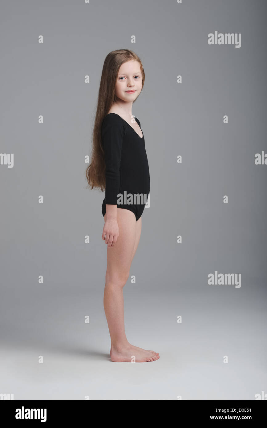 little girl studio portrait on grey background Stock Photo - Alamy