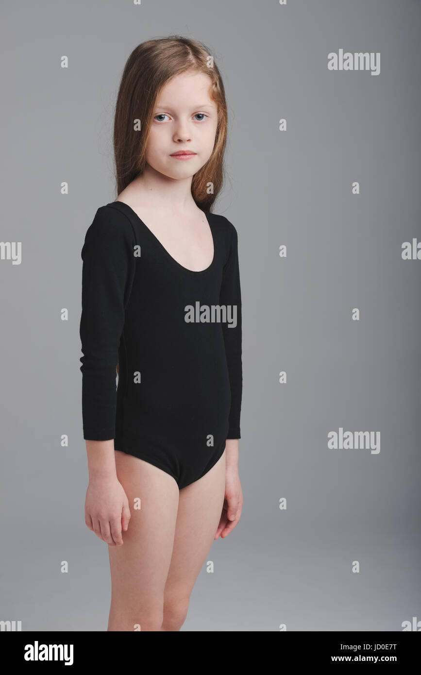 little girl studio portrait on grey background Stock Photo - Alamy