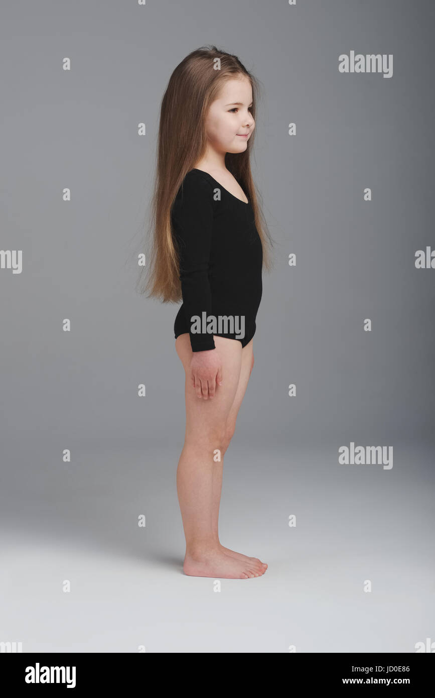 little girl studio portrait on grey background Stock Photo - Alamy