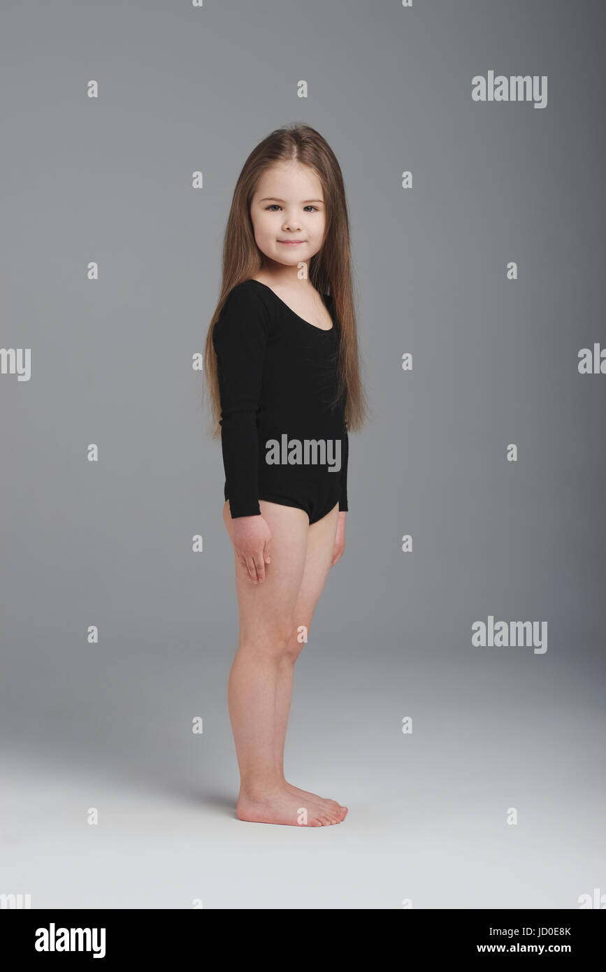 little girl studio portrait on grey background Stock Photo - Alamy