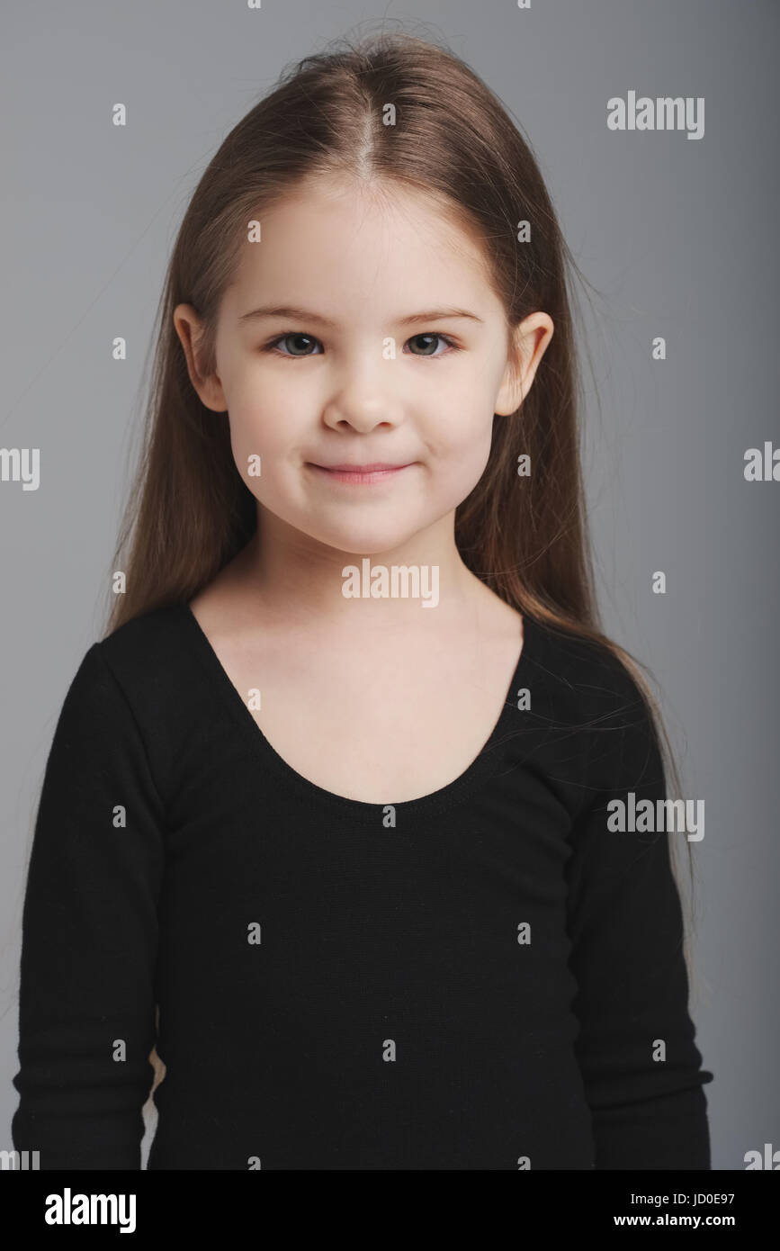 little girl studio portrait on grey background Stock Photo - Alamy