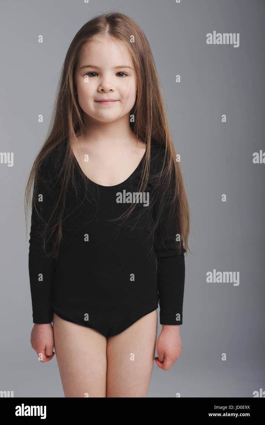 little girl studio portrait on grey background Stock Photo - Alamy