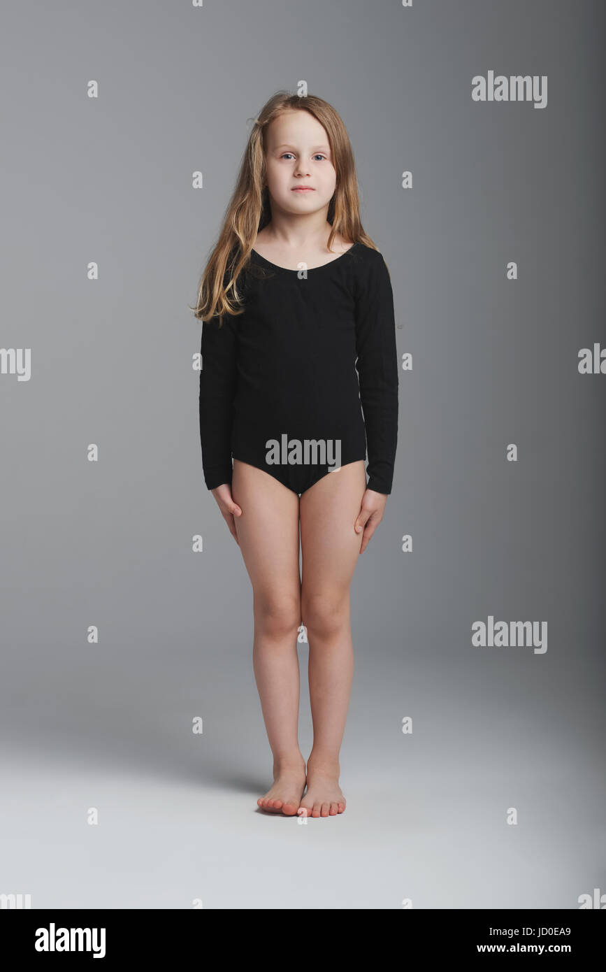 little girl studio portrait on grey background Stock Photo - Alamy