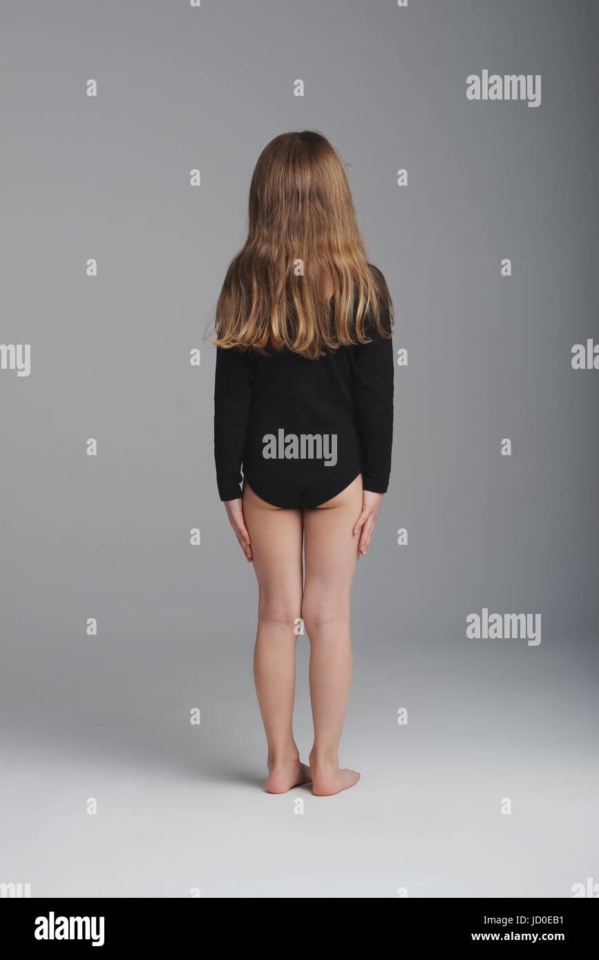 little girl studio portrait on grey background Stock Photo - Alamy