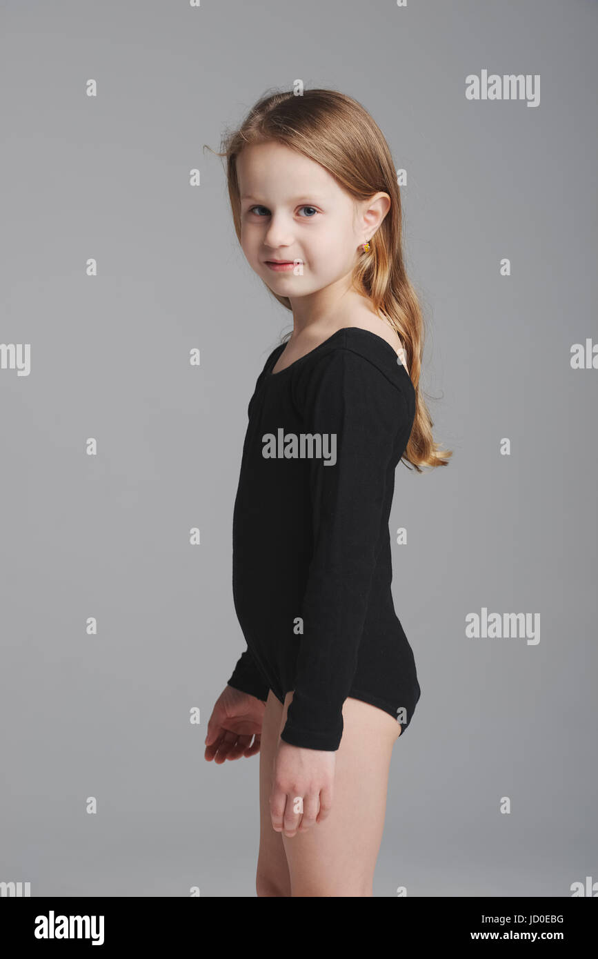 little girl studio portrait on grey background Stock Photo - Alamy
