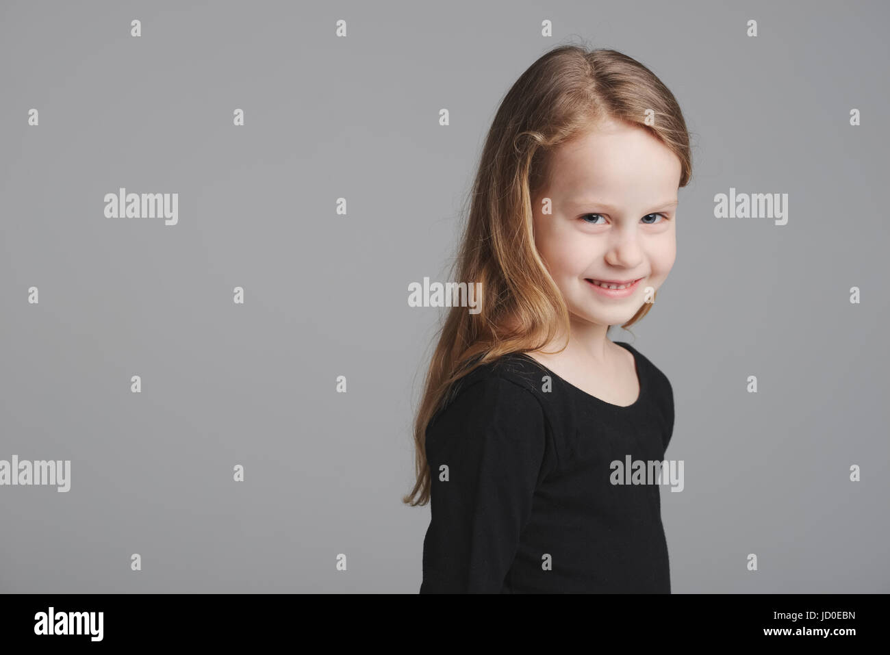 little girl studio portrait on grey background Stock Photo - Alamy