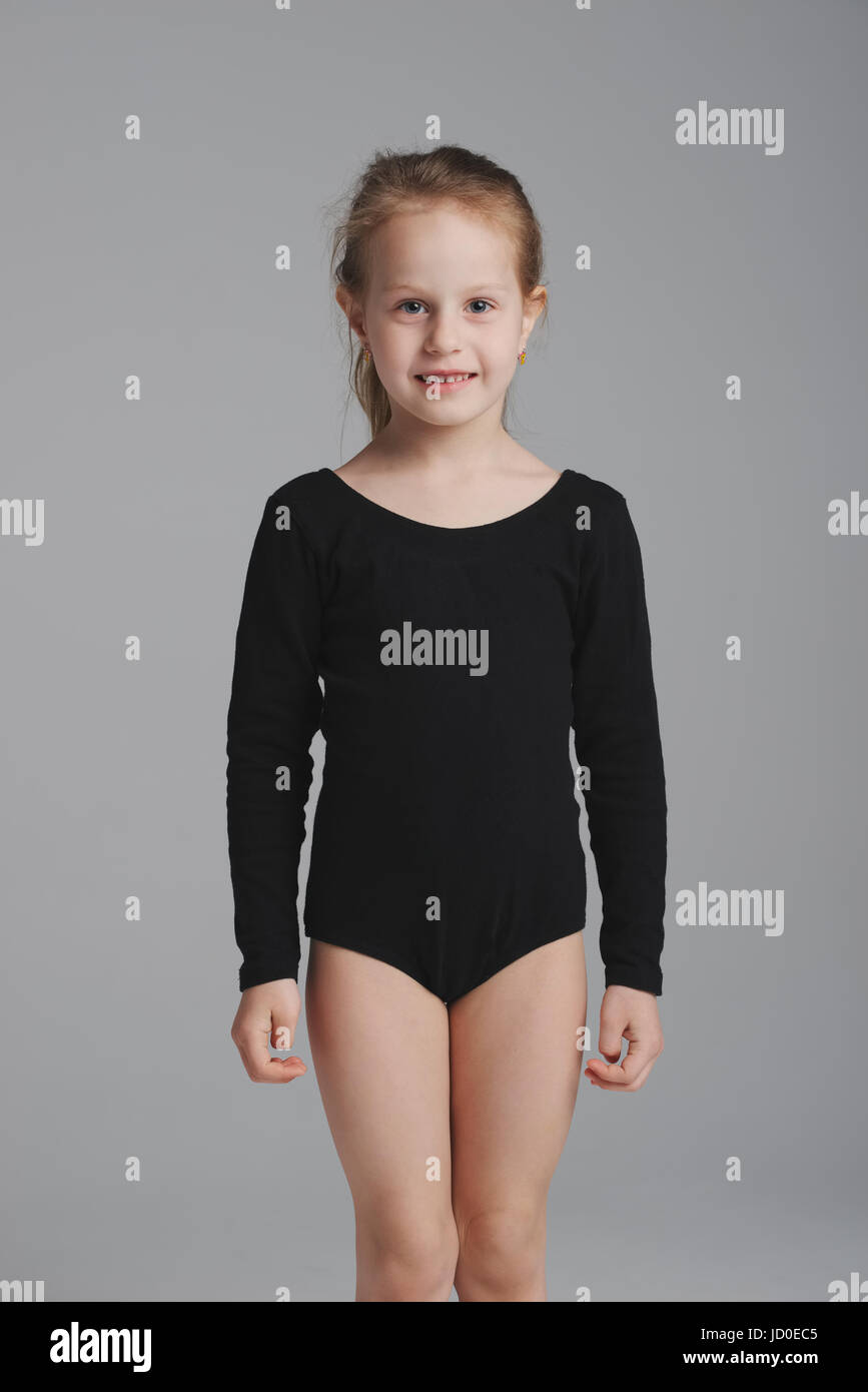 little girl studio portrait on grey background Stock Photo - Alamy