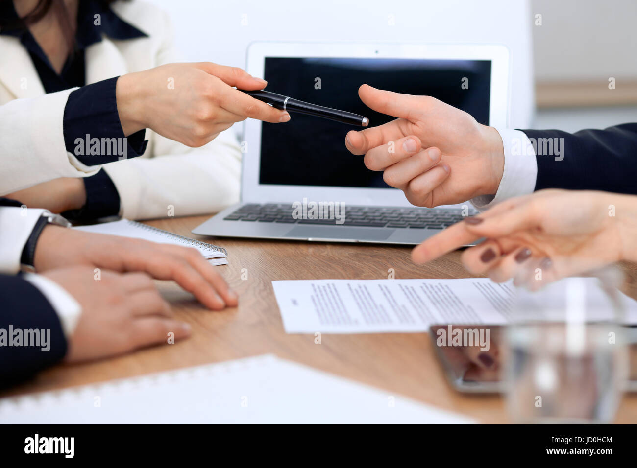Business women giving pen business hi-res stock photography and images ...
