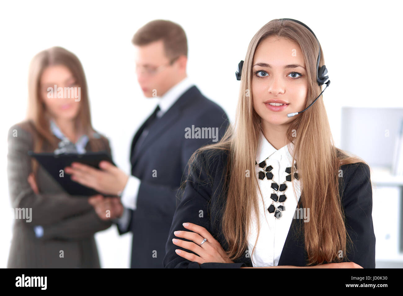 Portrait of beautiful cheerful smiling call operator on the background ...