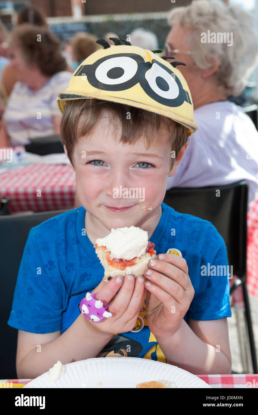 Child eating afternoon tea hi-res stock photography and images - Alamy