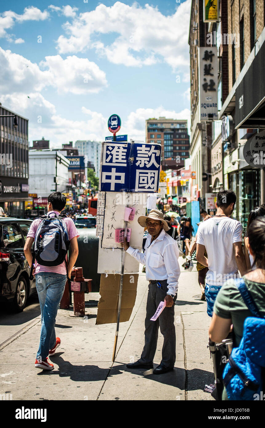 New York City, New York, USA. 7th Aug, 2016. A man hands out Chinese ...