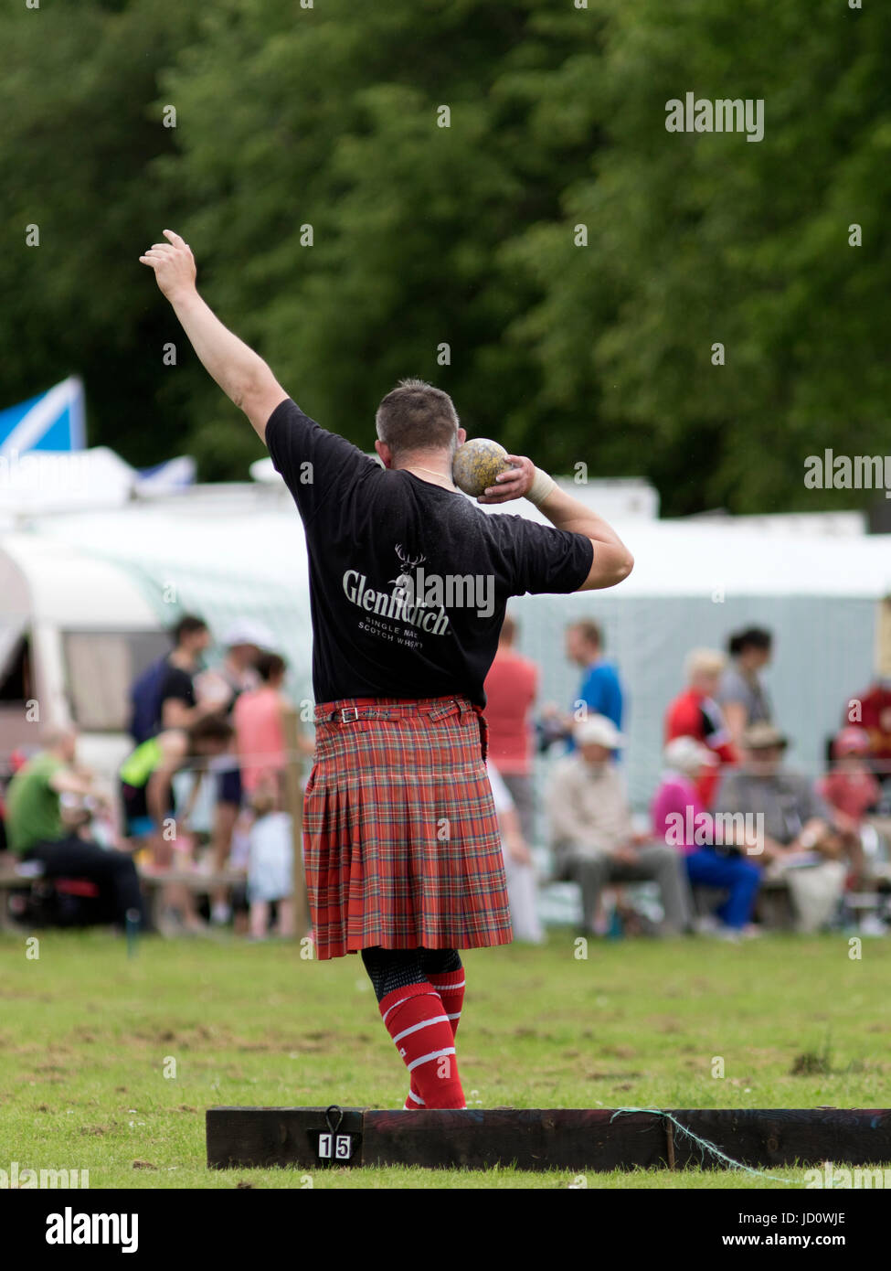 Stone put man throwing stone highland hi-res stock photography and ...