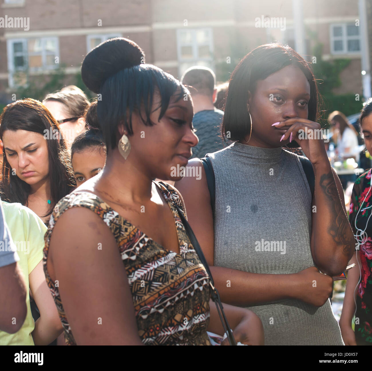 London, United Kingdom. 17th June 2017. Two women crying as they bring ...