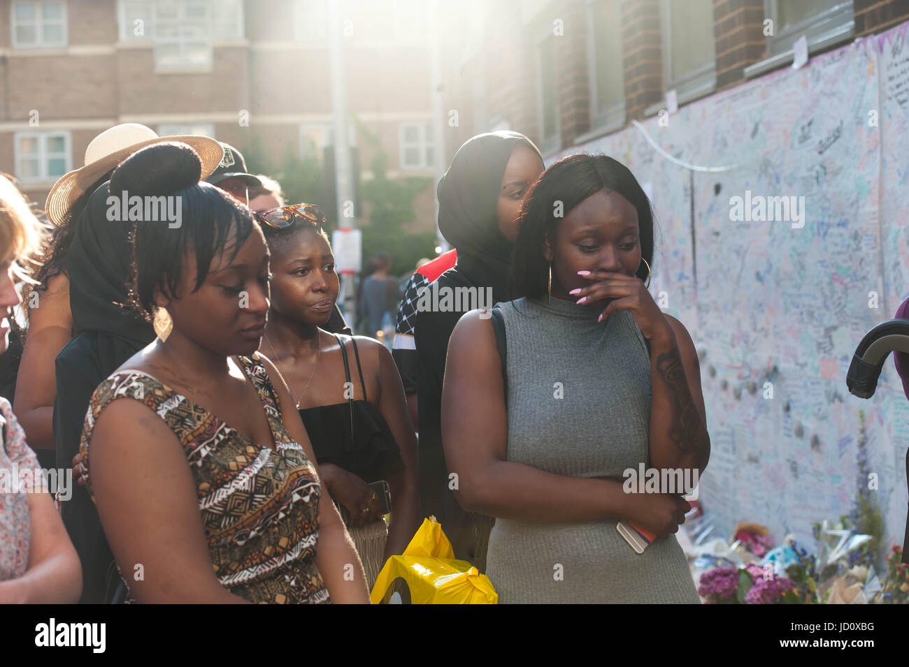 London, United Kingdom. 17th June 2017. Two women crying as they bring ...