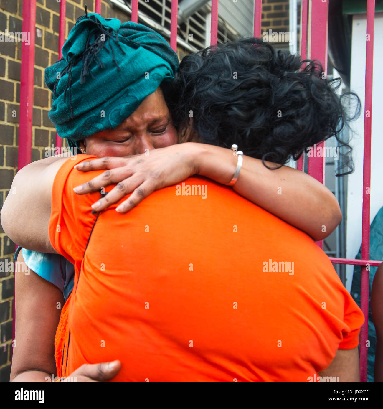 London, United Kingdom. 17th June 2017. Two women crying as they bring ...