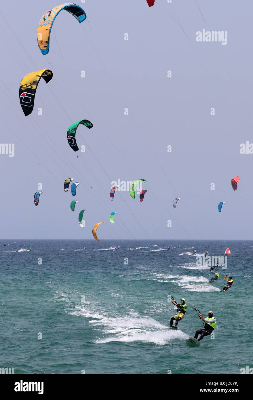 Colorful sky over beach Colorful kites from kiteboarders adorn the sky ...