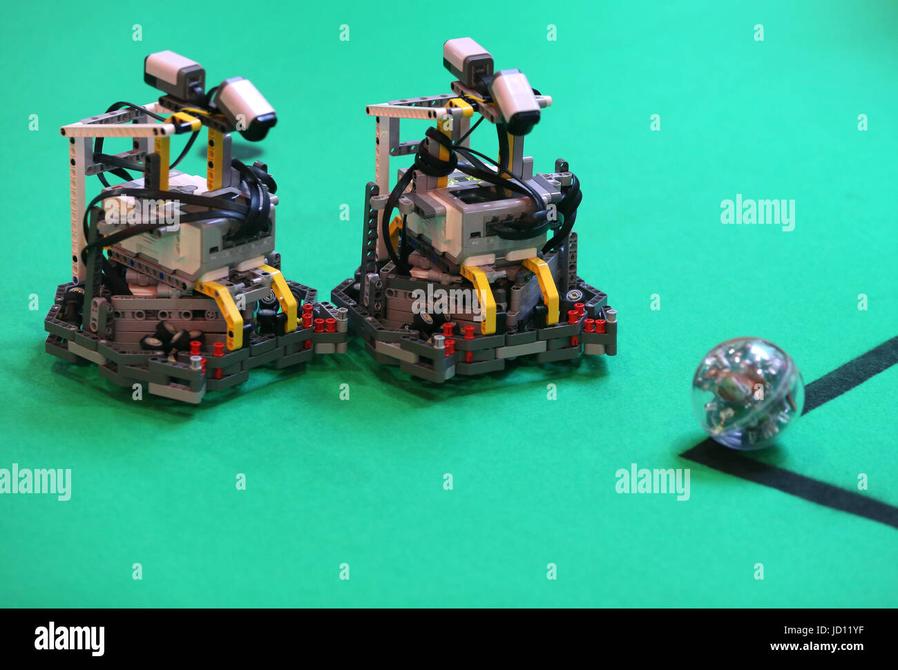 Schweinfurt, Germany. 17th June, 2017. Two robots vie for soccer ball ...