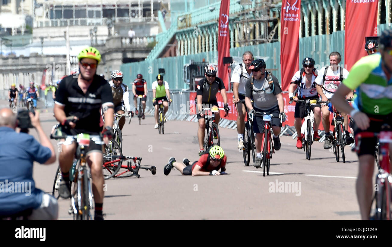 Brighton, UK. 18th June, 2017. A cyclist takes a tumble near the ...