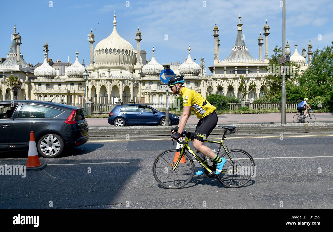Brighton, UK. 18th June, 2017. Cyclists pass the Royal Pavilion as they ...