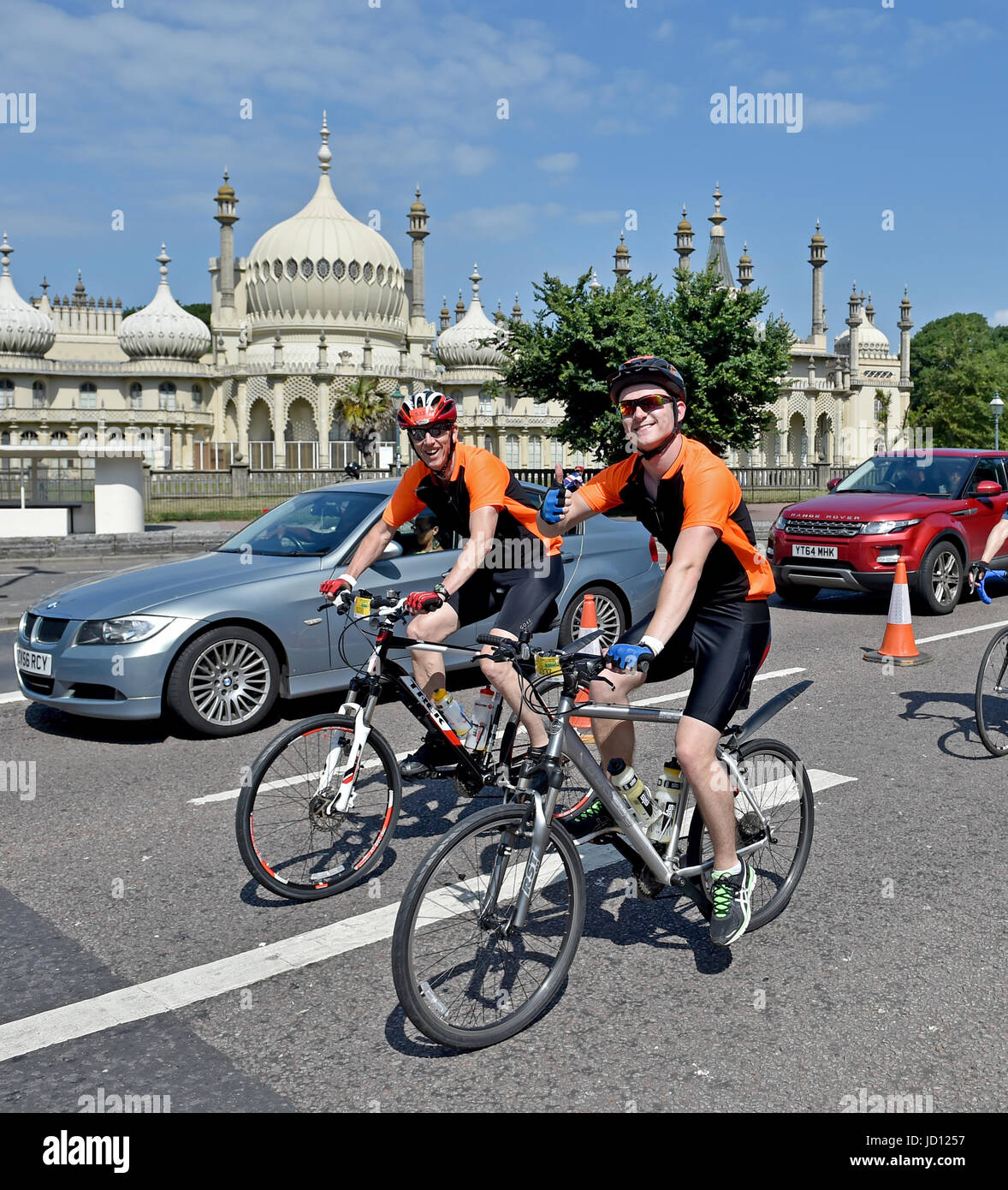 Brighton, UK. 18th June, 2017. Cyclists pass the Royal Pavilion as they ...