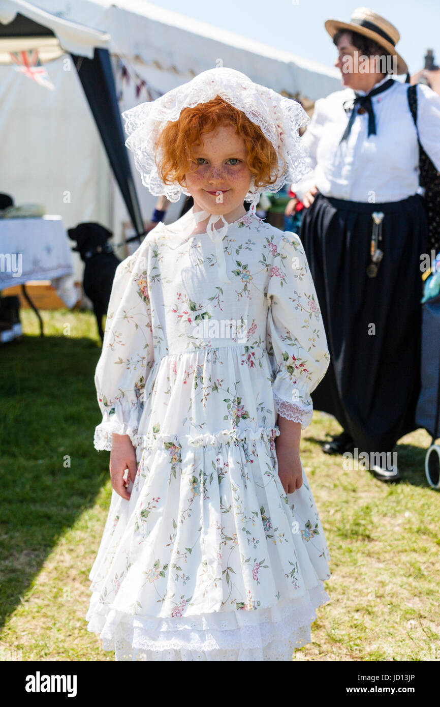 Caucasian child, girl, 5-6 years old, with curly ginger hair, standing ...