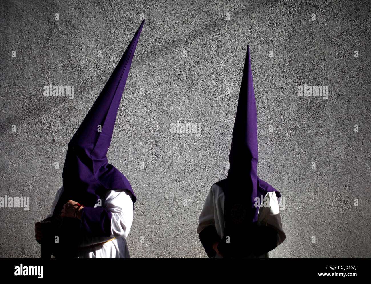 Penitents wearing pointed hoods during Easter Week celebrations in ...