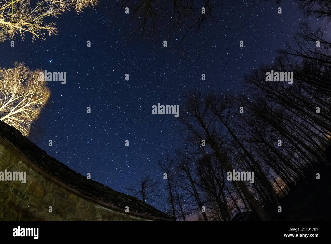 Fisheye view of the starry sky with blurred motion clouds, captured ...