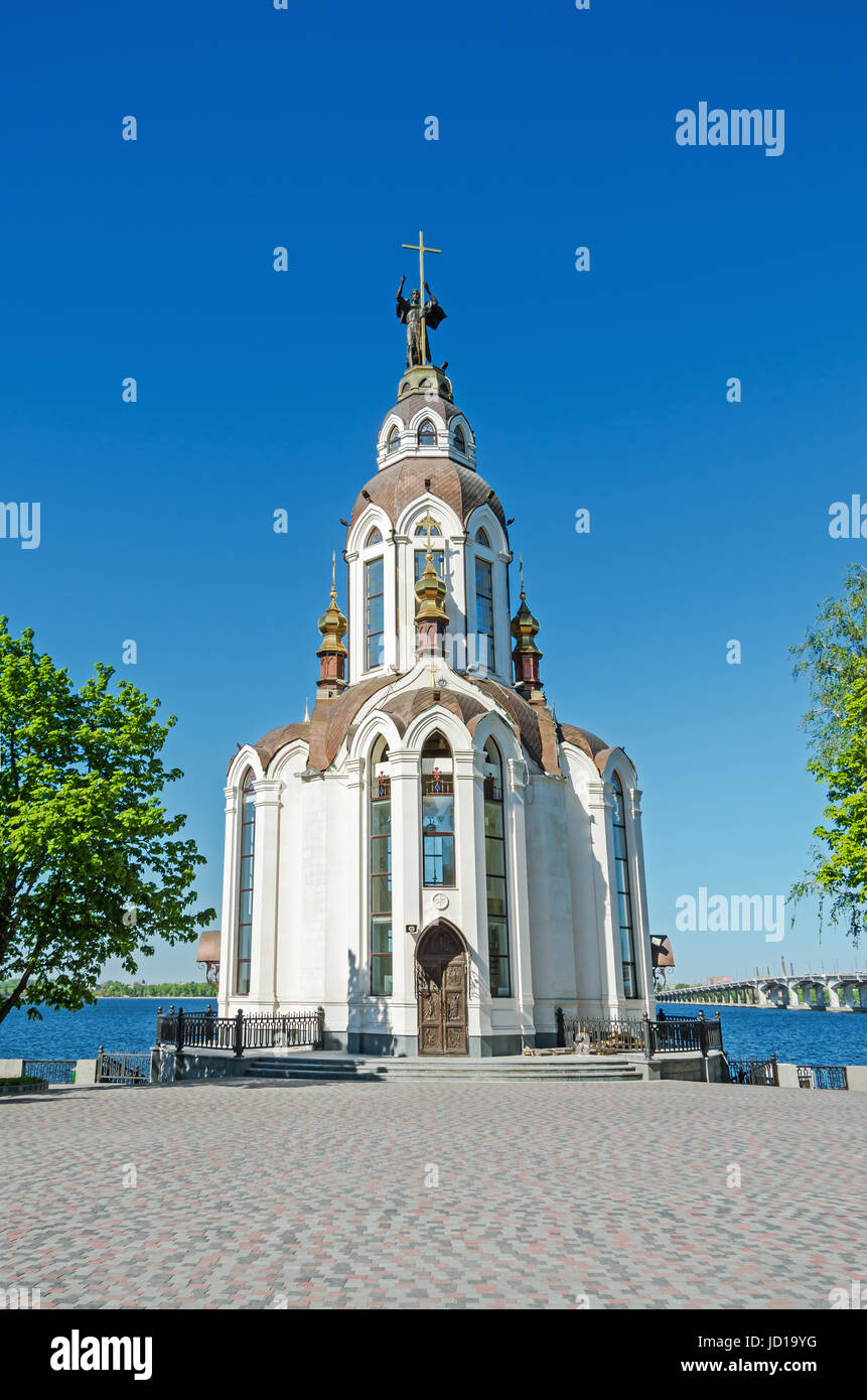 Orthodox temple on the waterfront against the blue sky in end of April ...
