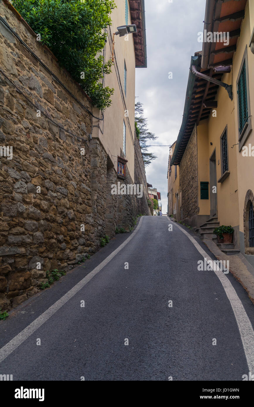 Narrow uphill street with walls on both sides in Fiesole, Italy Stock ...