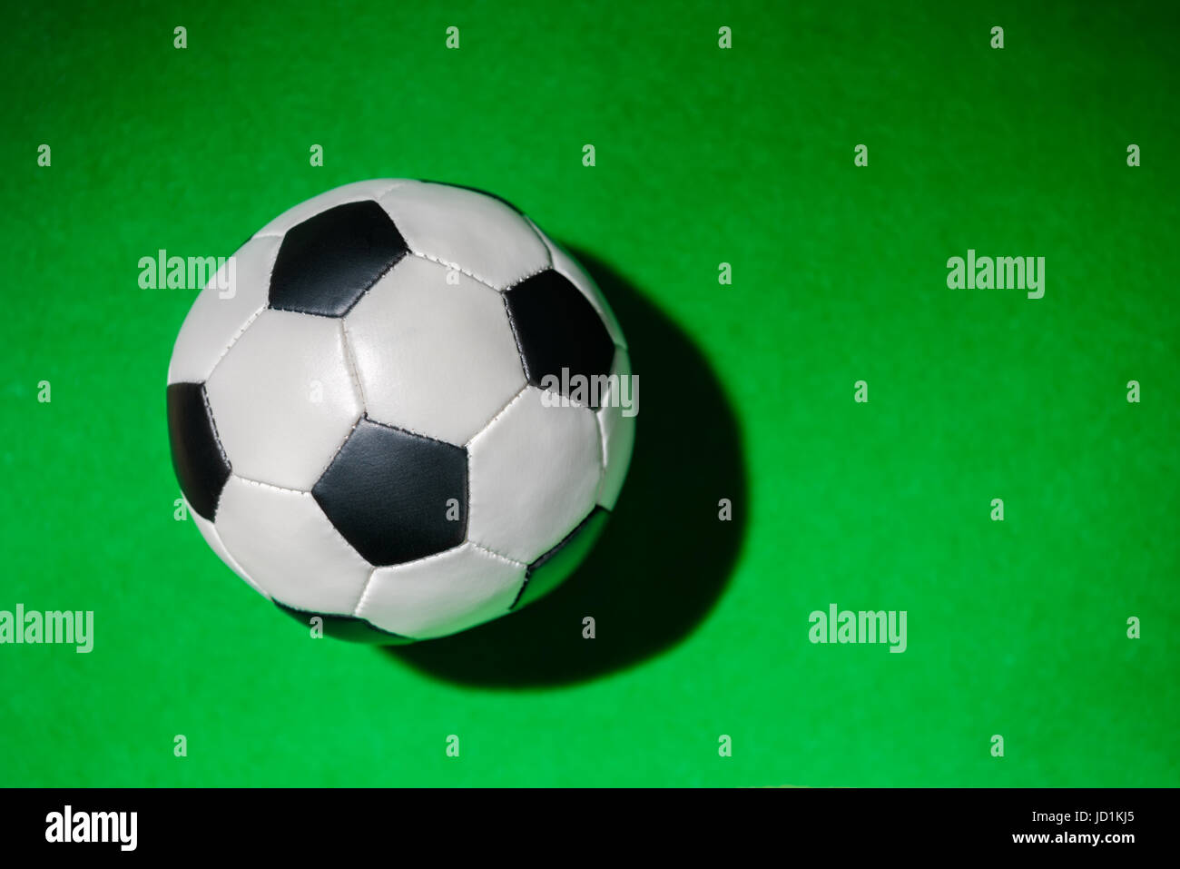 top view of soccer ball on green grass background Stock Photo - Alamy