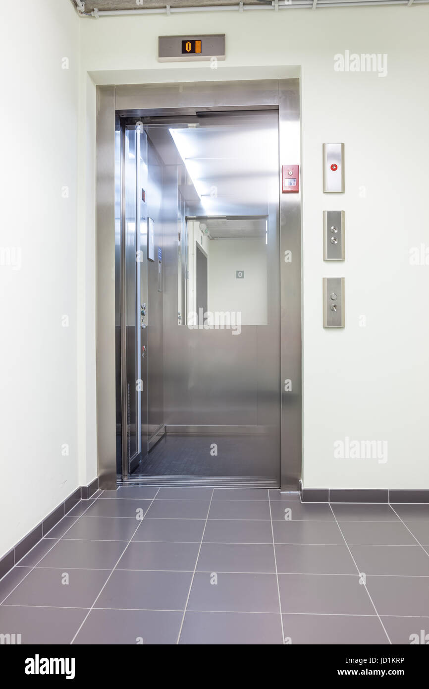 elevator on the ground floor of an long corridor Stock Photo - Alamy