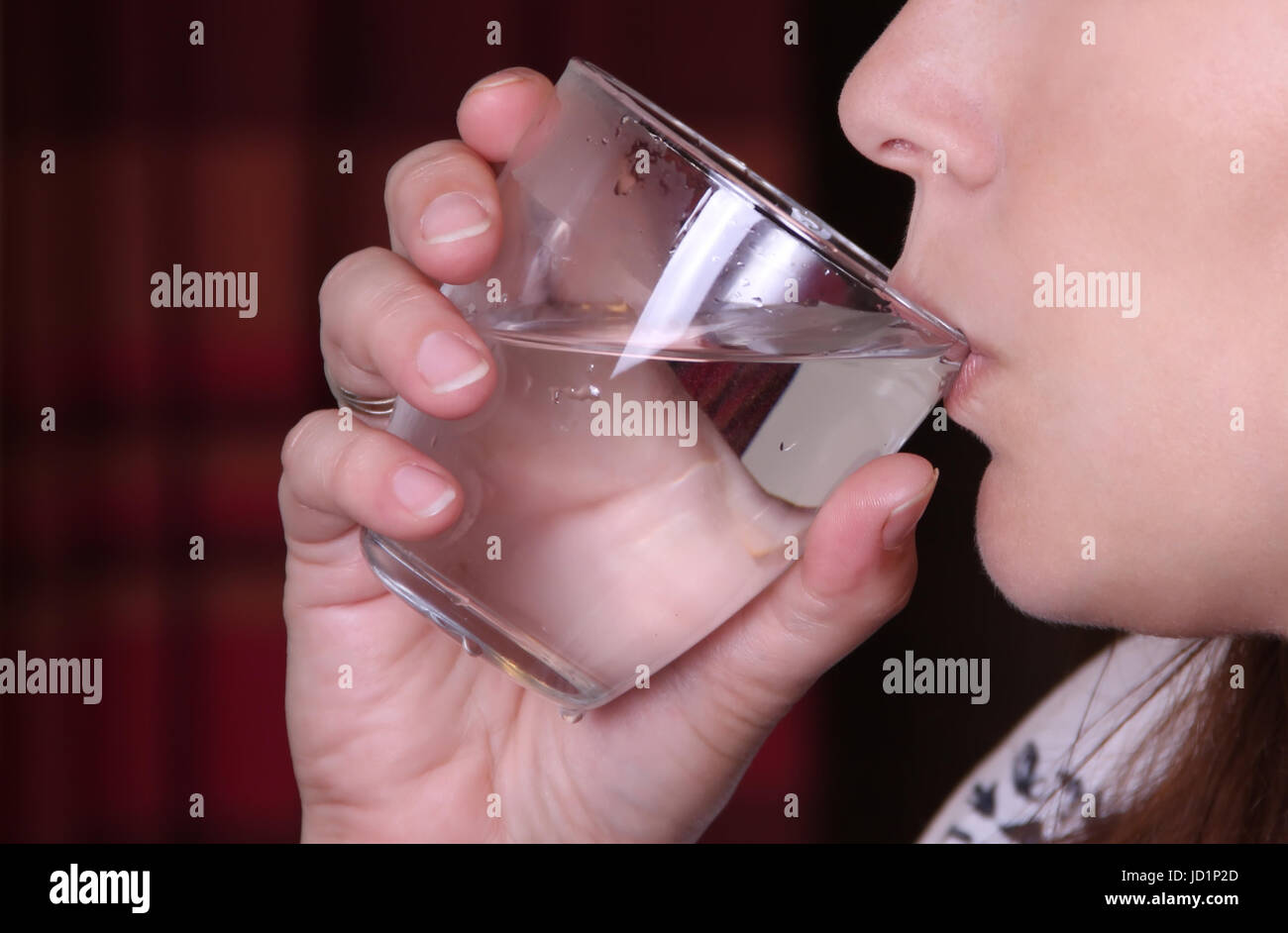 Woman drinking water Stock Photo - Alamy