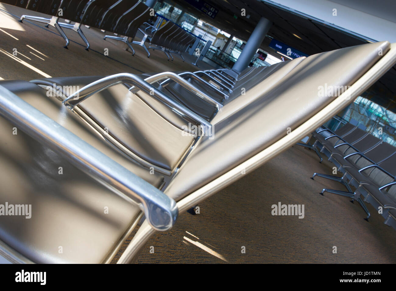 Seating area airport gate Stock Photo - Alamy