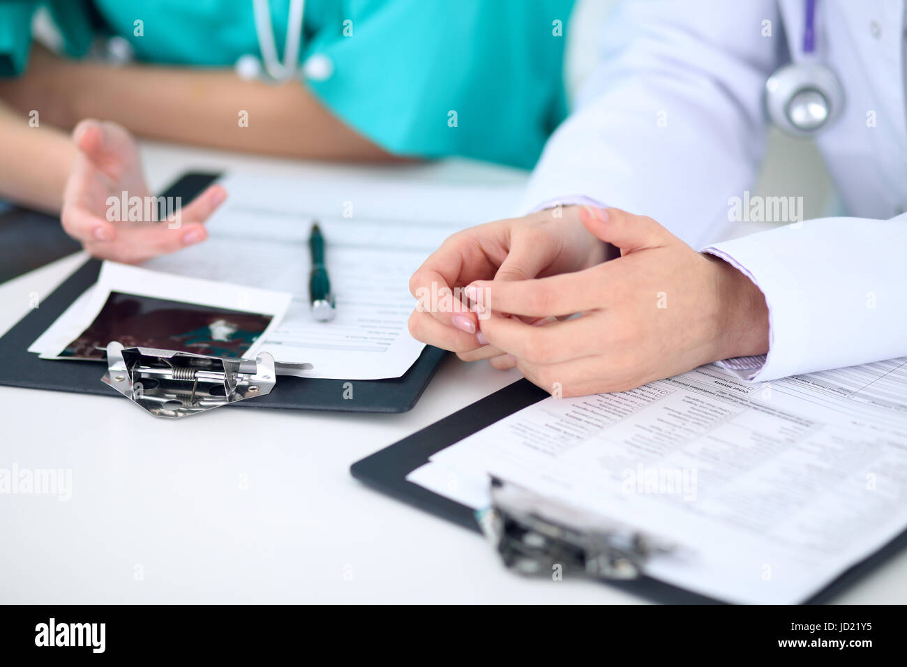 Female doctor and young surgeon intern in hospital Stock Photo - Alamy