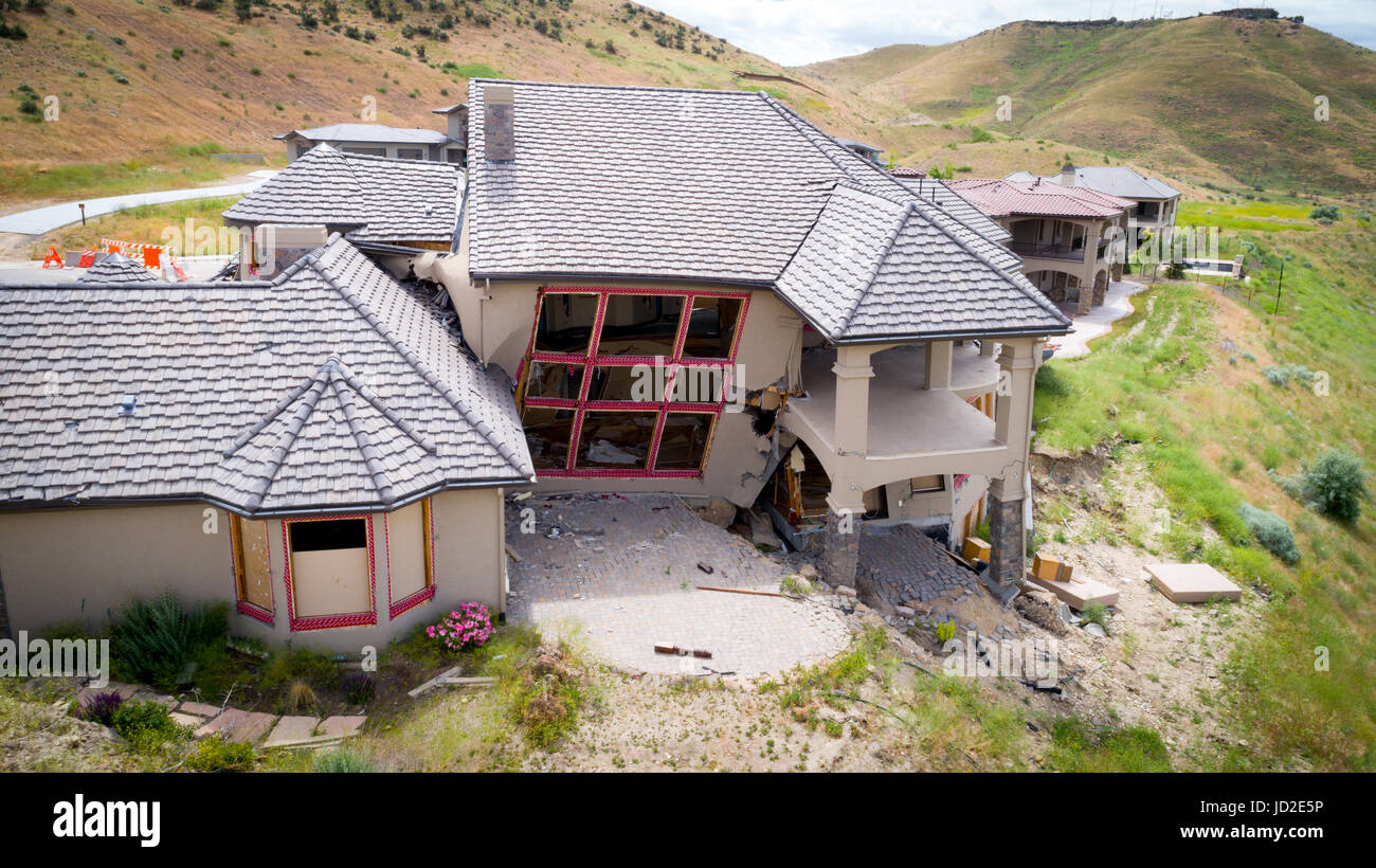 Walls are falling from a home caught in a landslide Stock Photo - Alamy