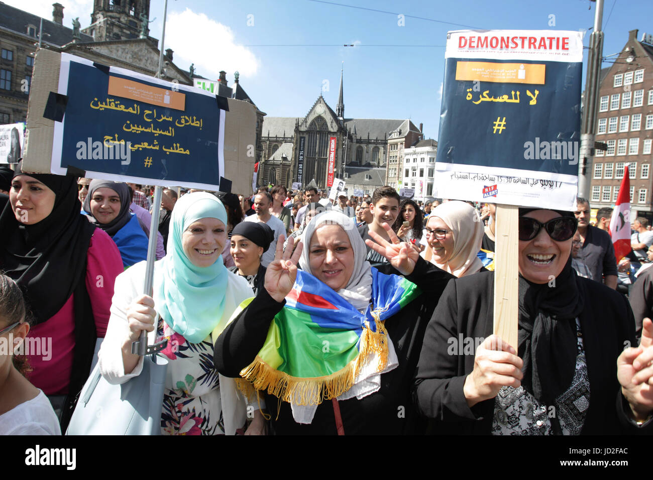 Moroccan immigrant and refugees hold posters in solidarity for Nasser ...