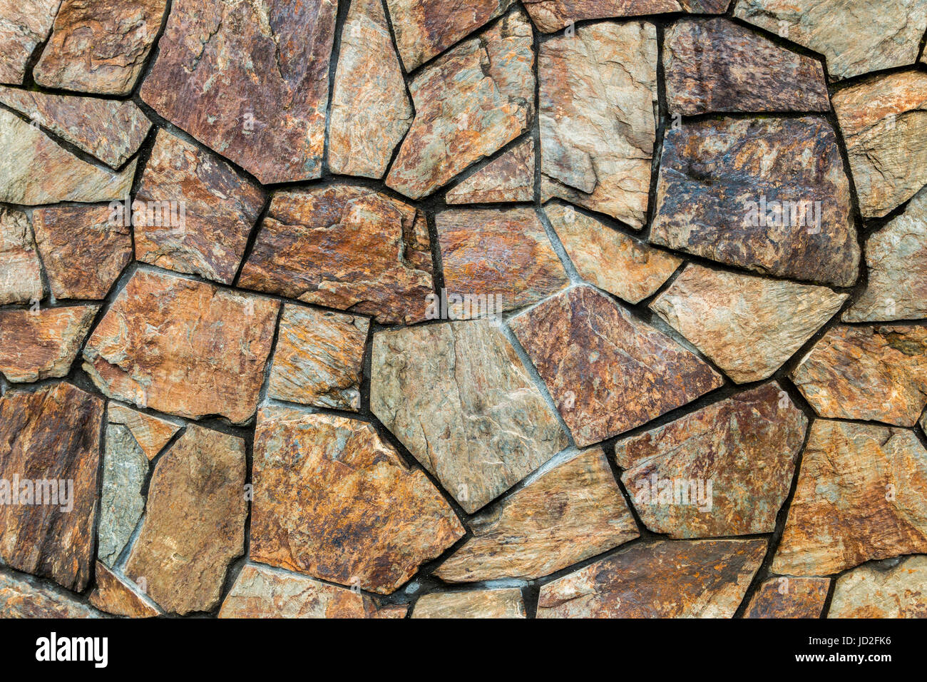 Wonderful color in this rock wall Stock Photo - Alamy