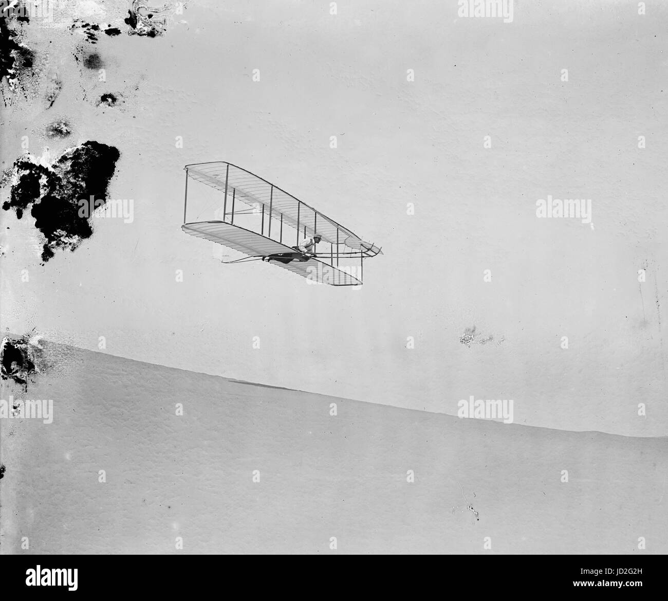 Wilbur gliding down steep slope of Big Kill Devil Hill; Kitty Hawk ...